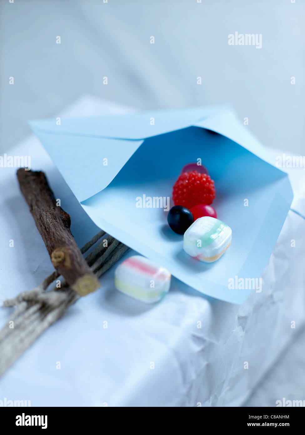 Licorice stick and candies in an envelope Stock Photo - Alamy