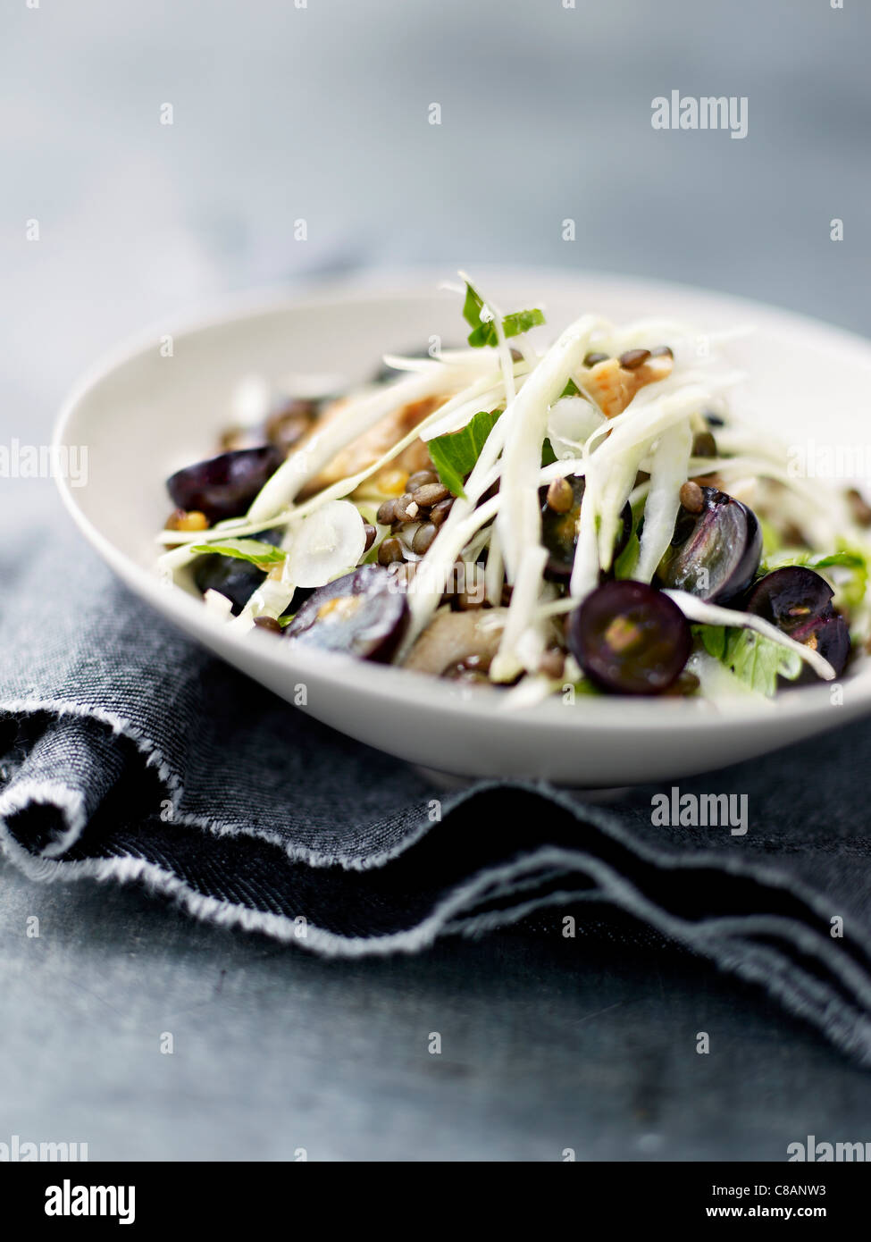 Chicken,white cabbage and black grape salad Stock Photo - Alamy