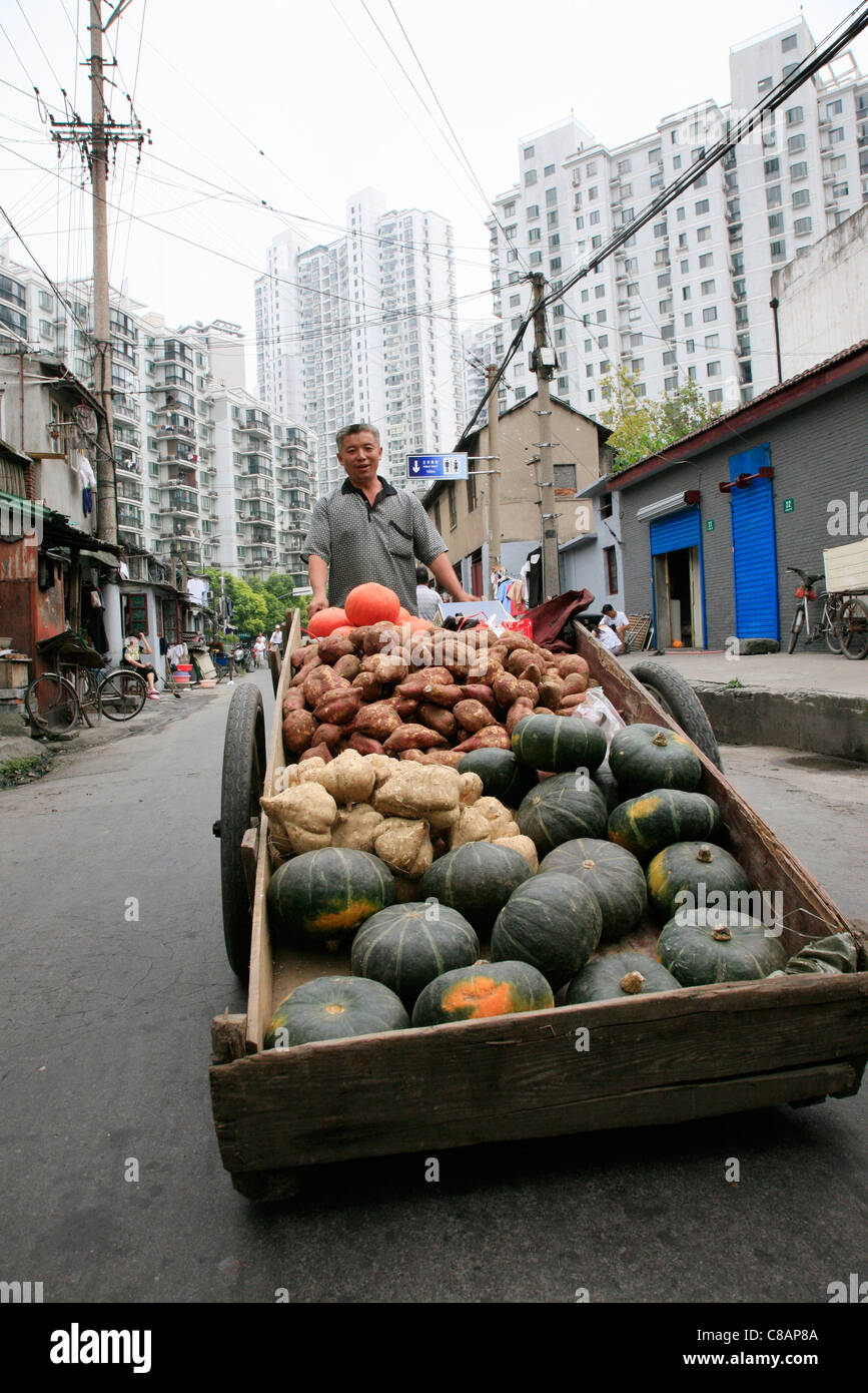 Farmer carrying vegetables on a trolley Stock Photo - Alamy