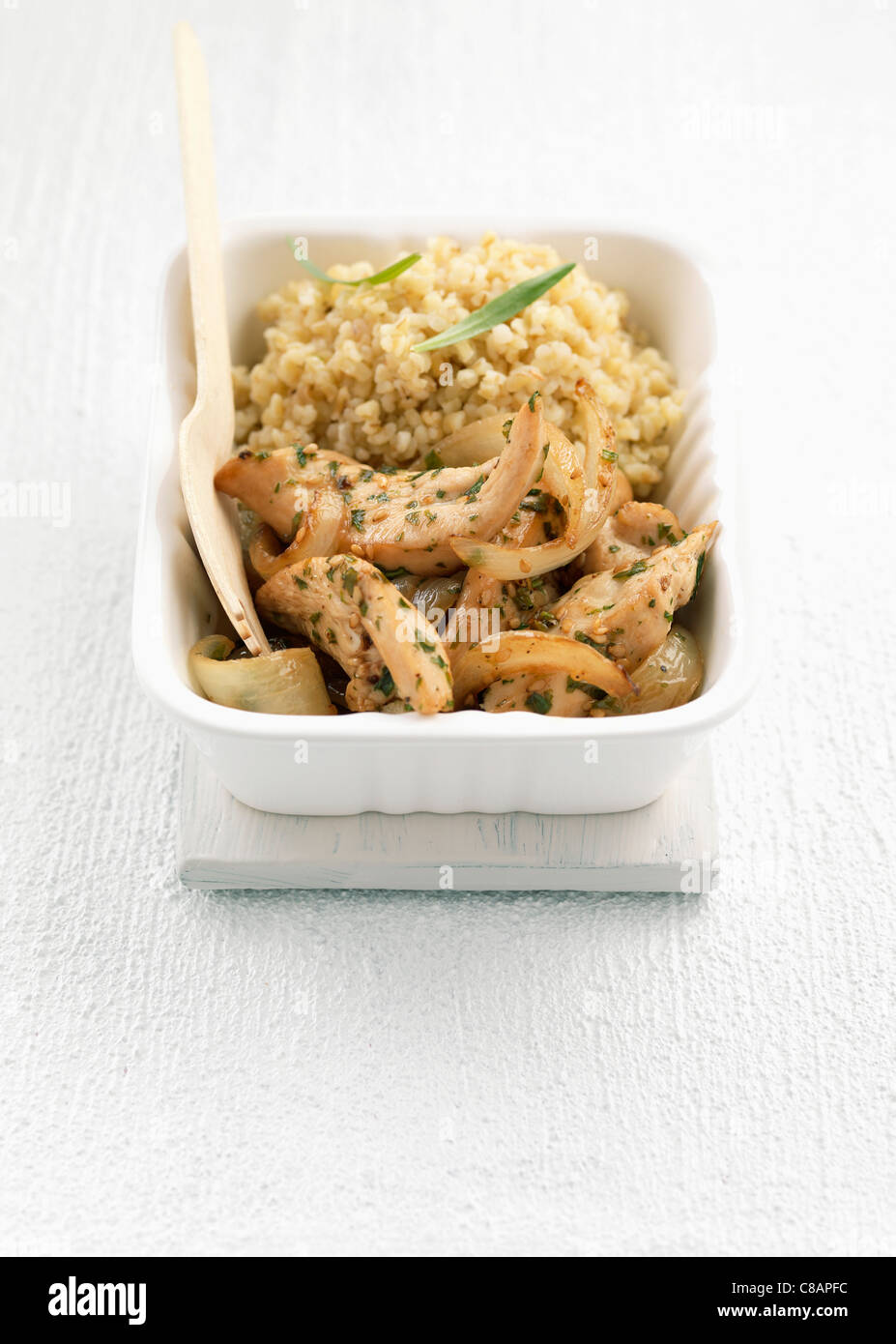 Pan-fried chicken with tarragon and bulghour Stock Photo - Alamy