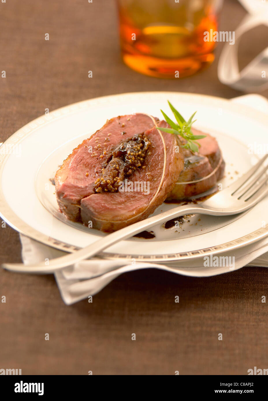 Roast duck Magret stuffed with figs Stock Photo - Alamy