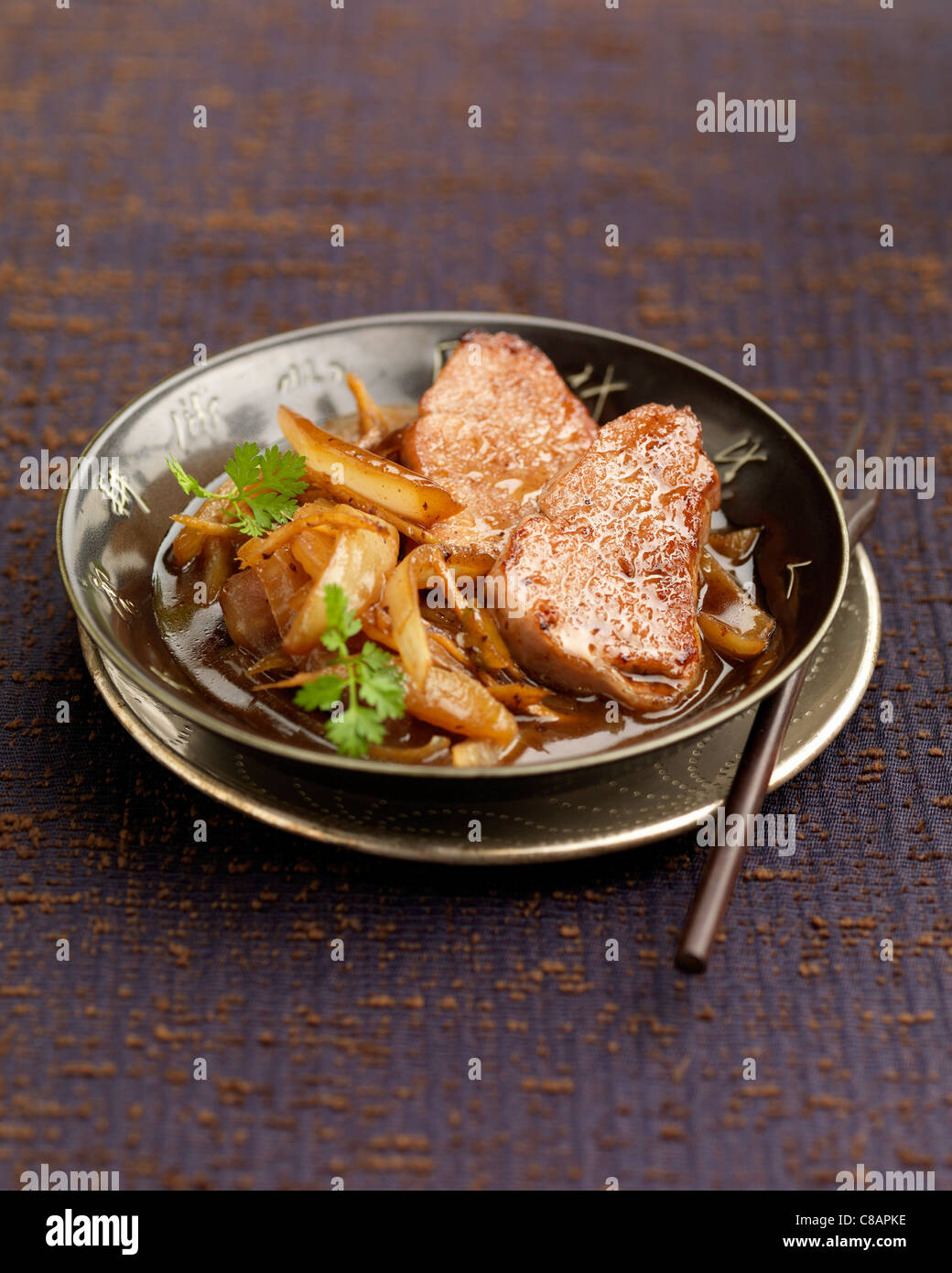 Pork filet mignon sauteed with onions Stock Photo - Alamy