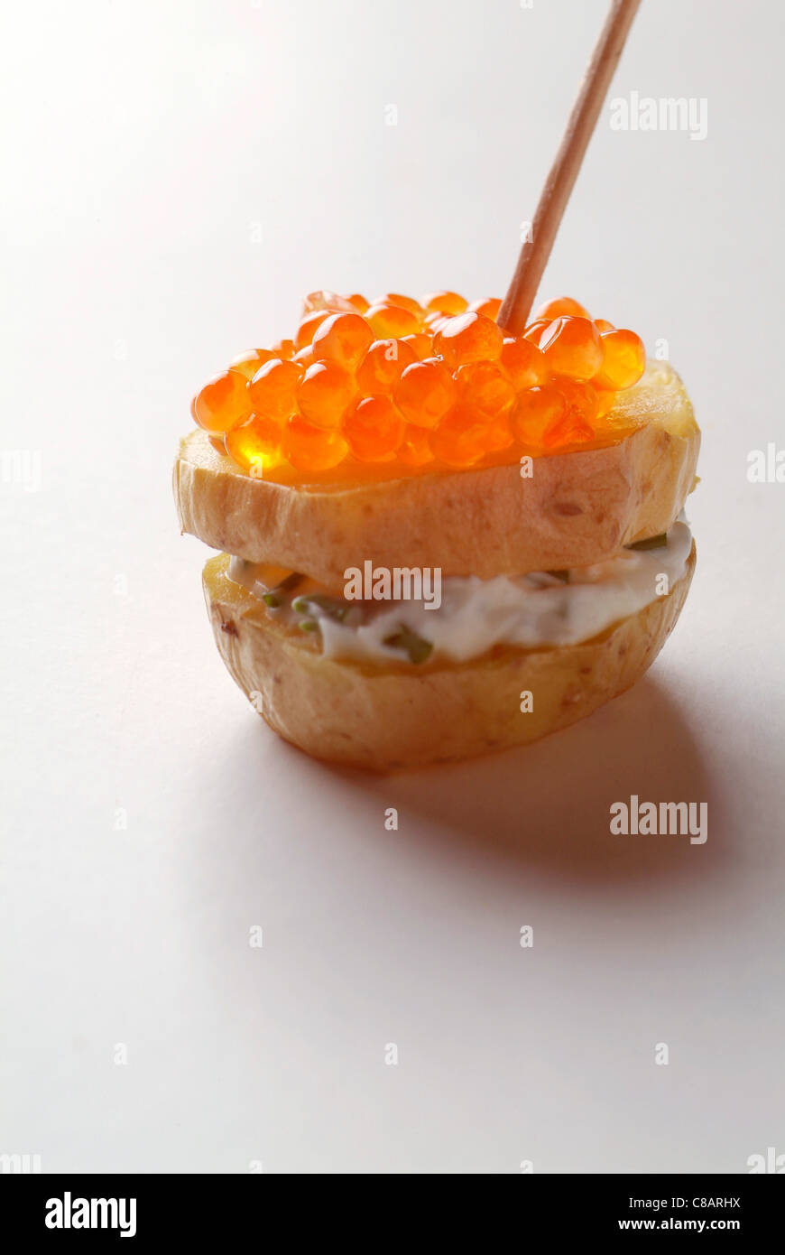 Potato and trout roe appetizer Stock Photo - Alamy