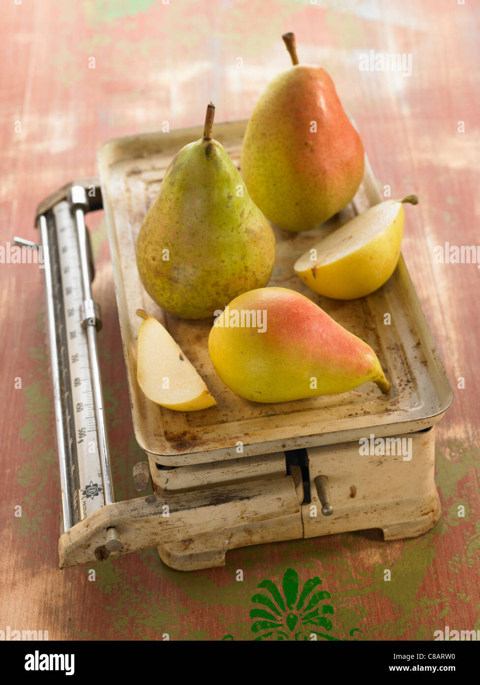 Pears on scales Stock Photo - Alamy
