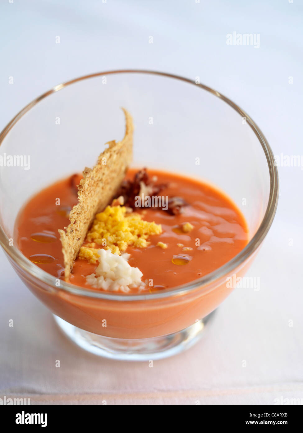 Tomato Gaspacho with grated hard-boiled egg and ham Stock Photo - Alamy