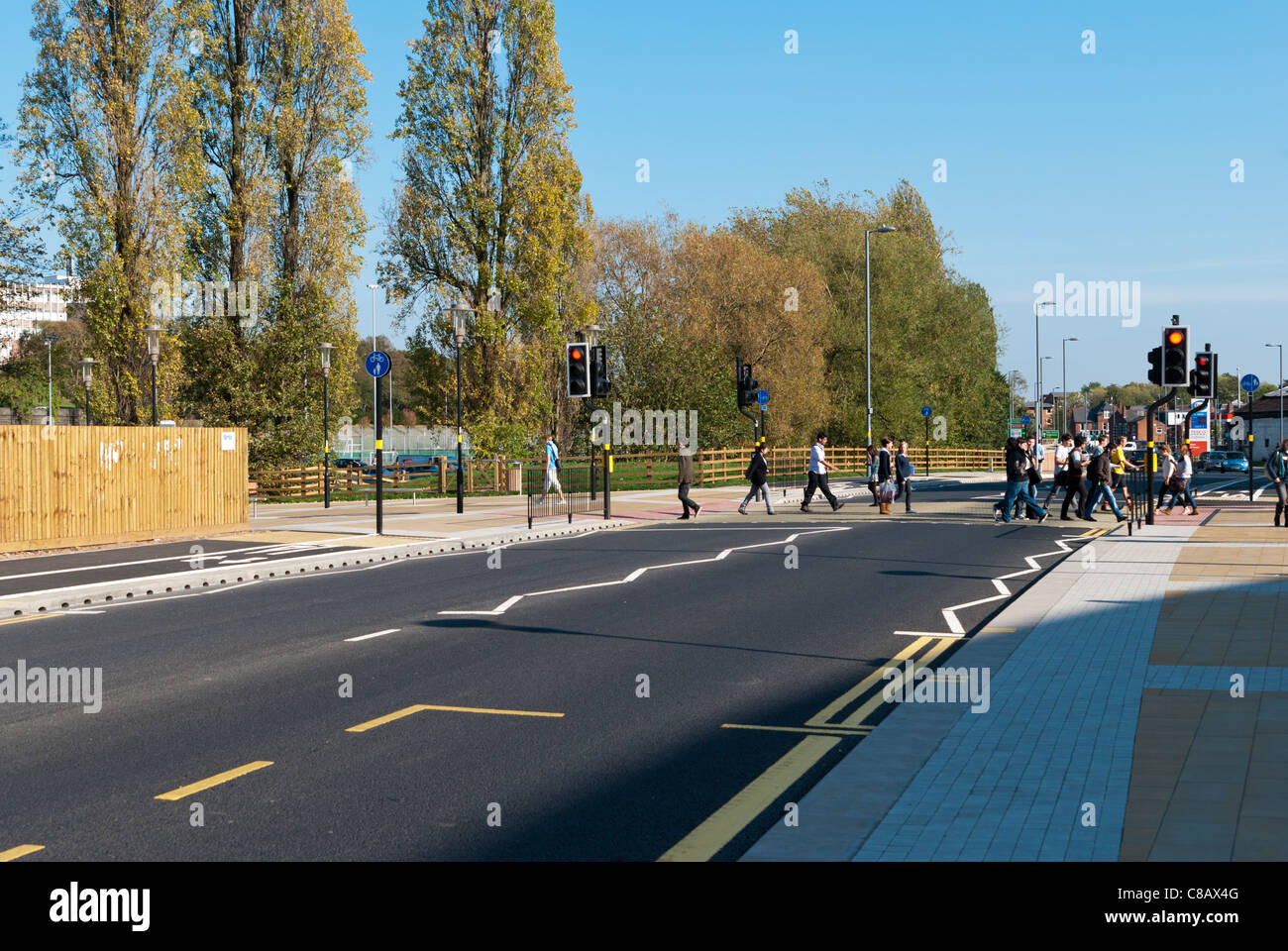 Students crossing the newly opened Selly Oak relief road by Birmingham ...