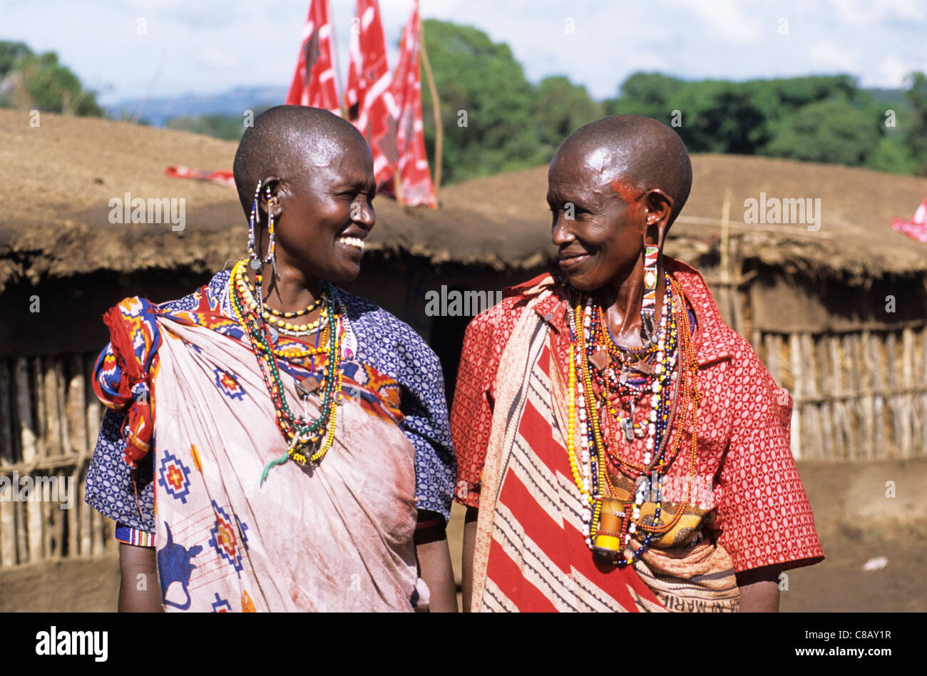 Lolgorian, Kenya. Siria Maasai Manyatta; two smiling woman, traditional ...