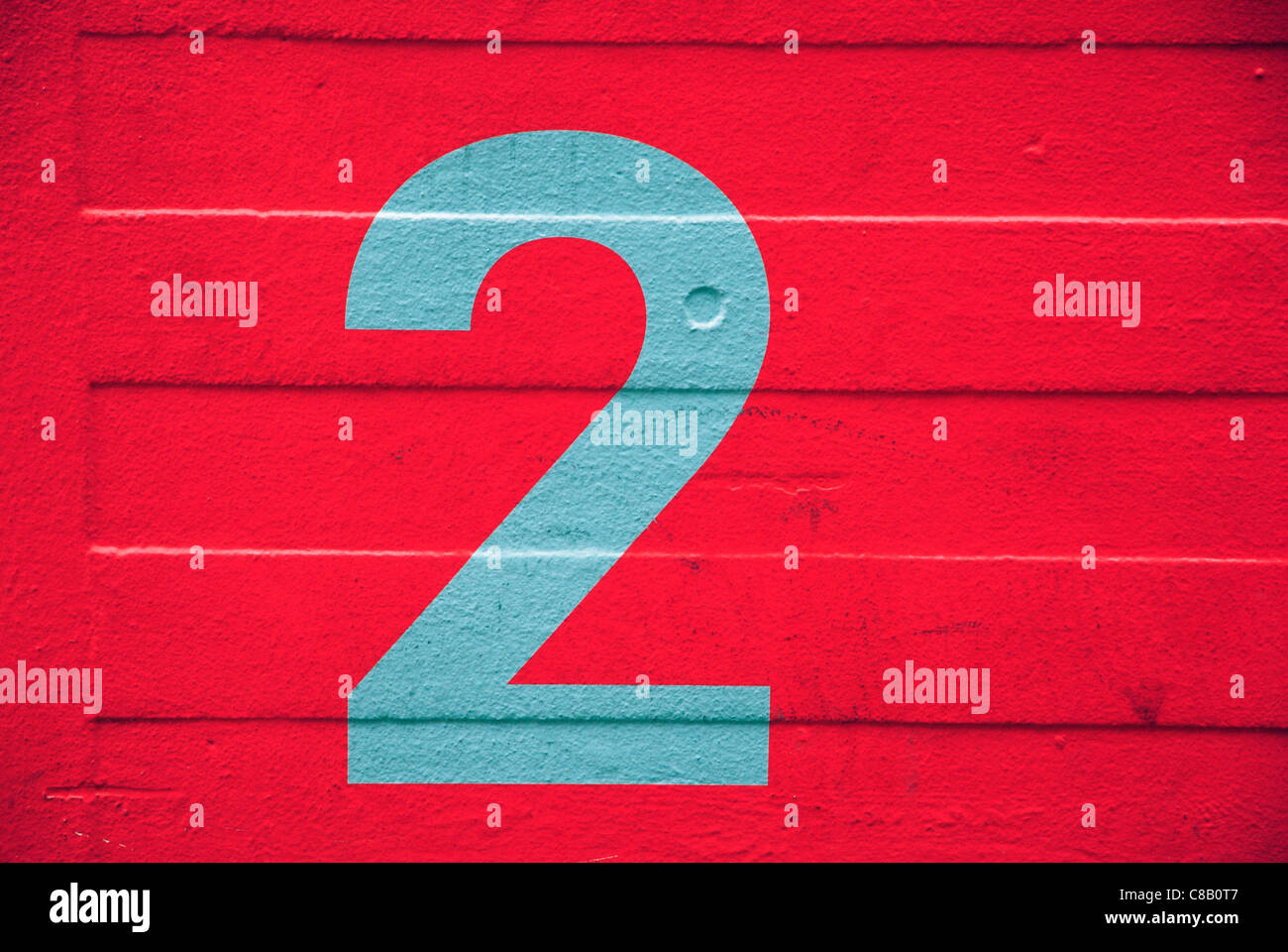 Number 2 on a bright red backround Stock Photo - Alamy