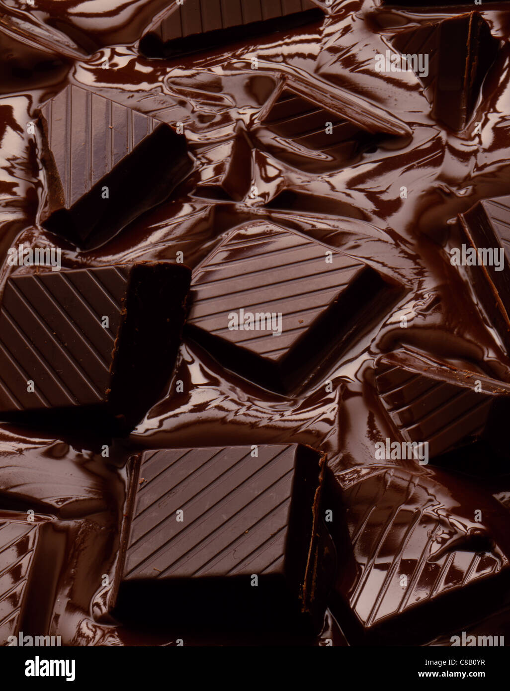 Melted squares of plain chocolate Stock Photo - Alamy