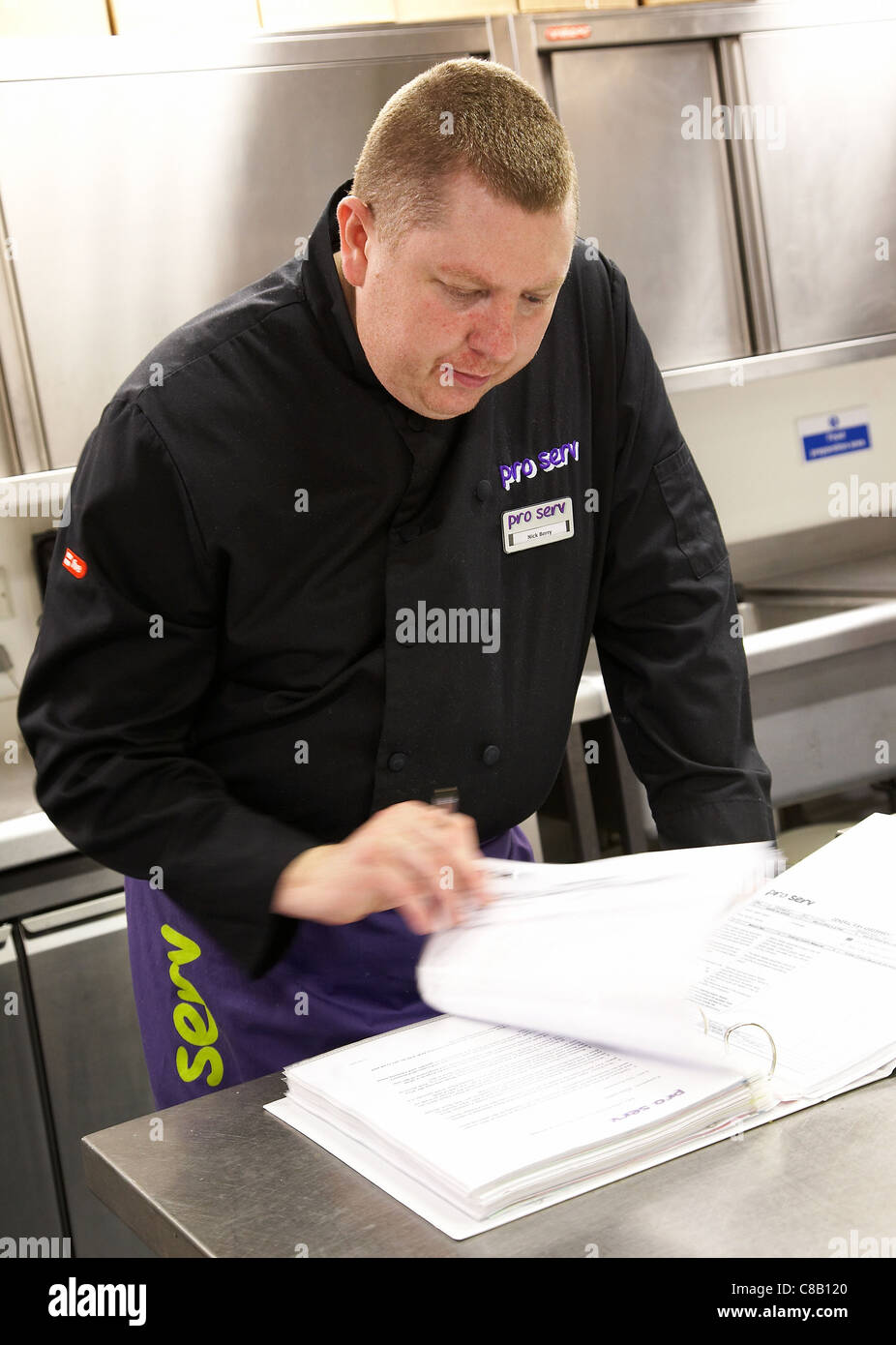 Chef in the kitchen checking orders Stock Photo - Alamy