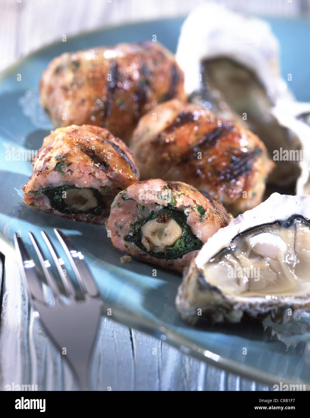 Crépinette oyster slices wrapped in sausage Stock Photo - Alamy