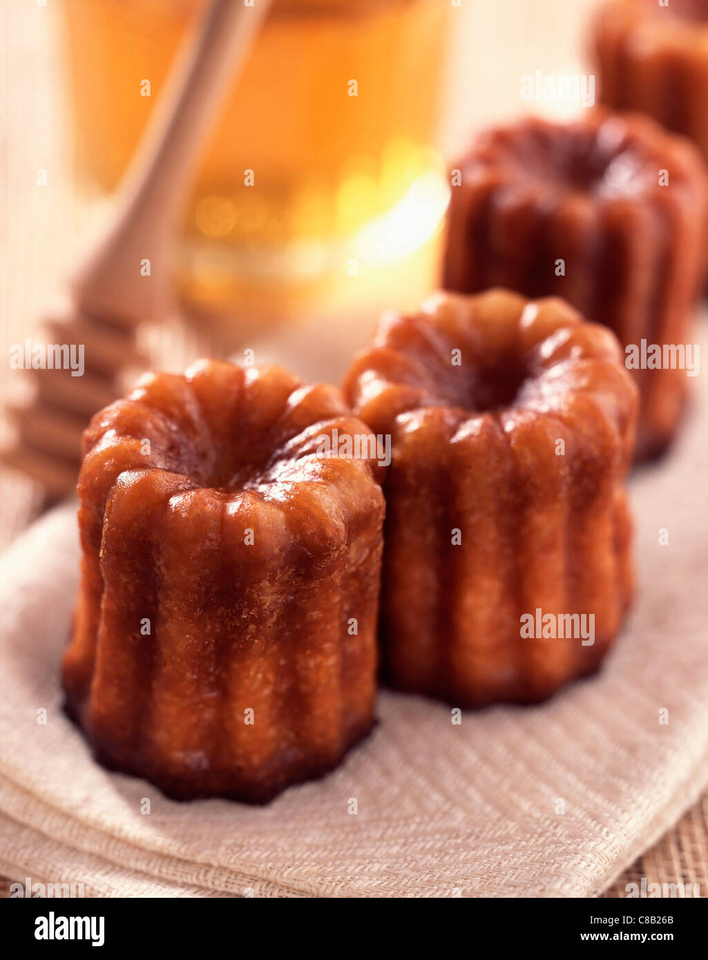 Cannelé honey cakes Stock Photo - Alamy