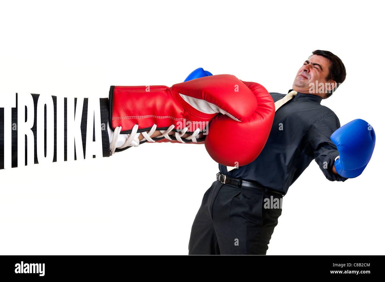 Businessman taking a hit by the Troika's hand Stock Photo - Alamy