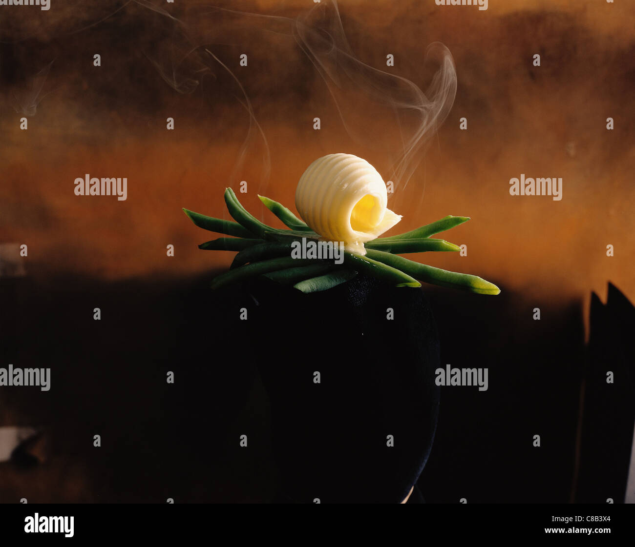 french beans and coil of butter Stock Photo - Alamy