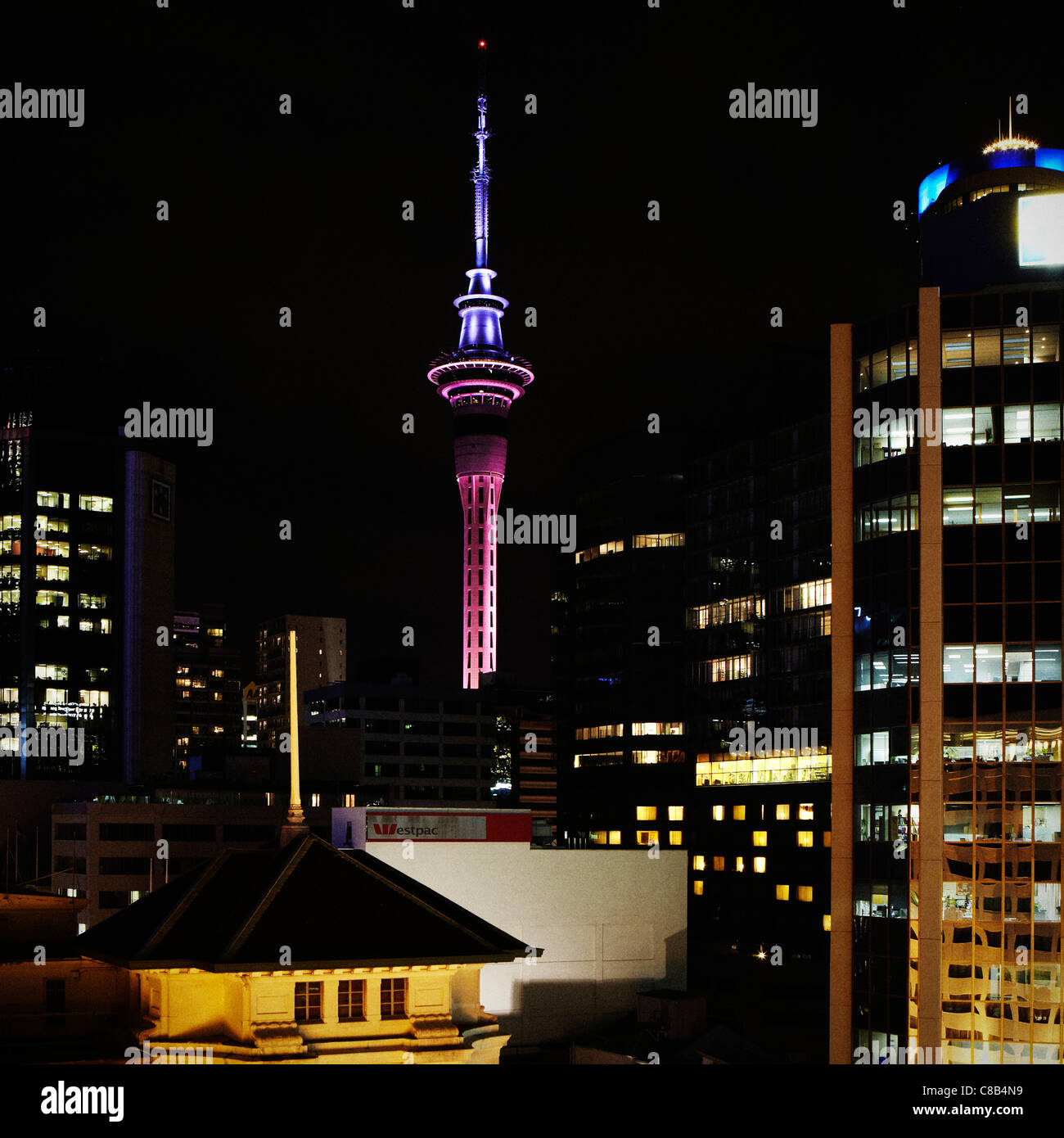 View of Auckland's Sky Tower lit up at night, New Zealand Stock Photo ...