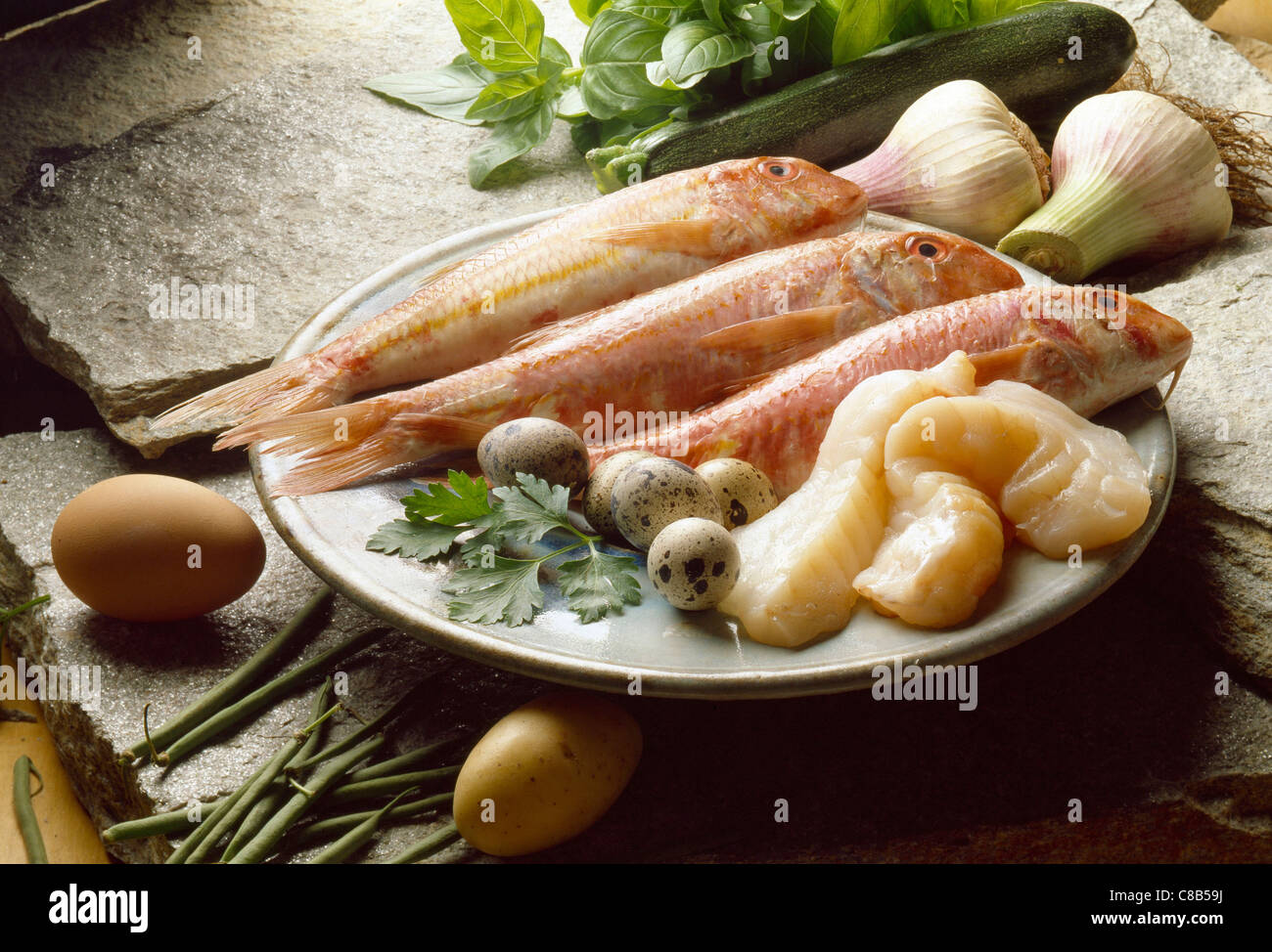 Whole raw red mullets and red mullet fillets Stock Photo - Alamy