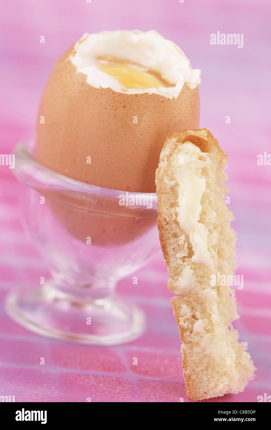 Boiled egg with bread soldier Stock Photo - Alamy