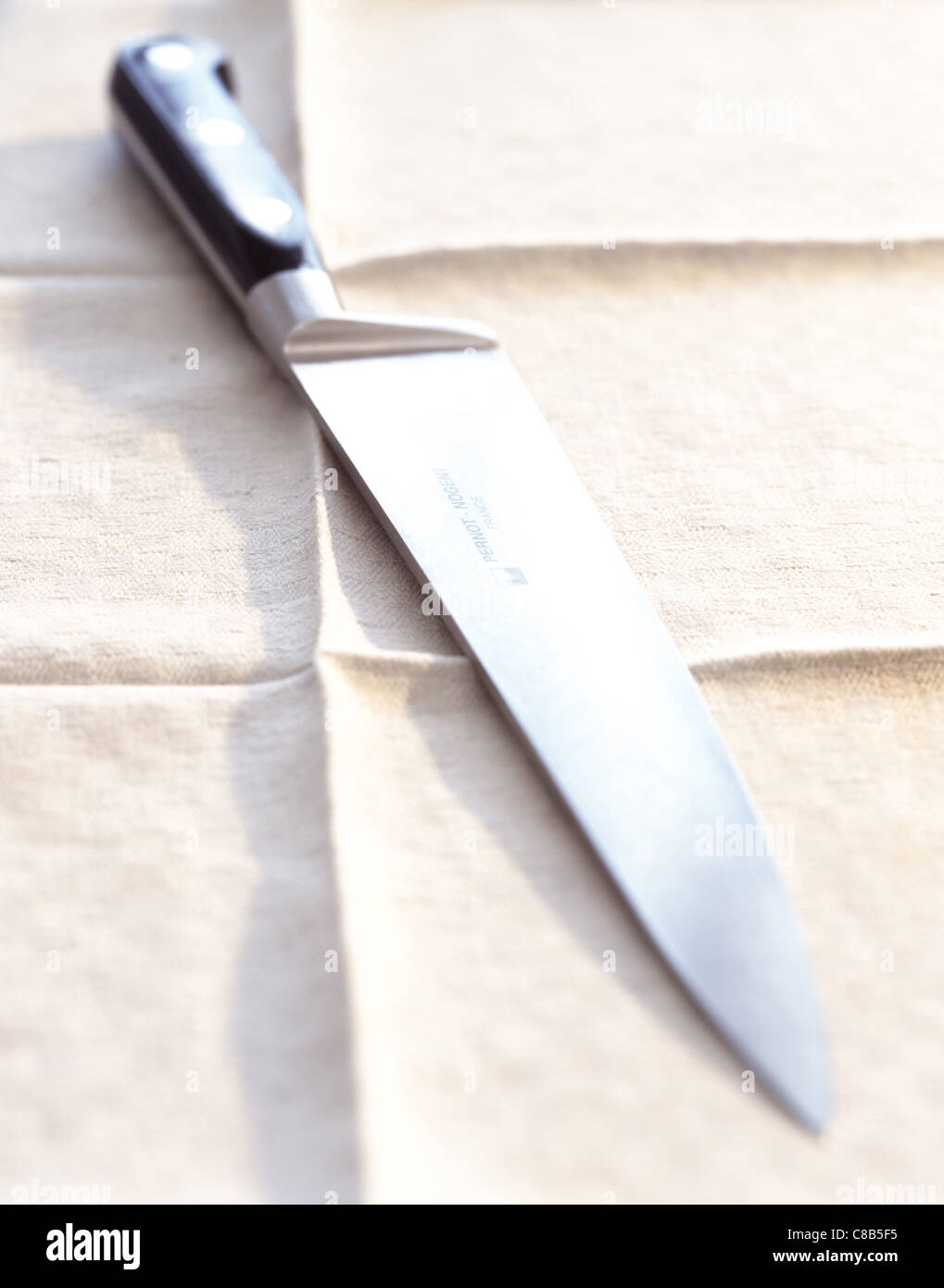 Chopping knife on cloth Stock Photo - Alamy