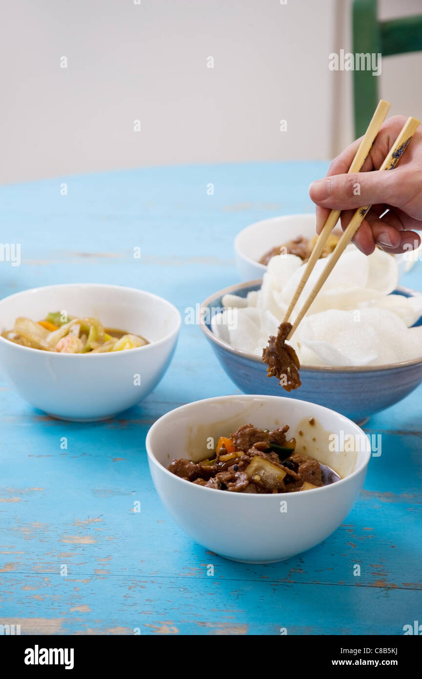 Chopsticks hand hi-res stock photography and images - Alamy