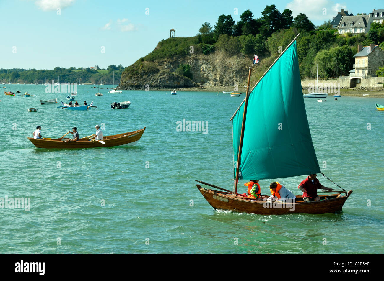 Le P'tit Gab (small sailboat whose hull is based on dory boat) and a ...