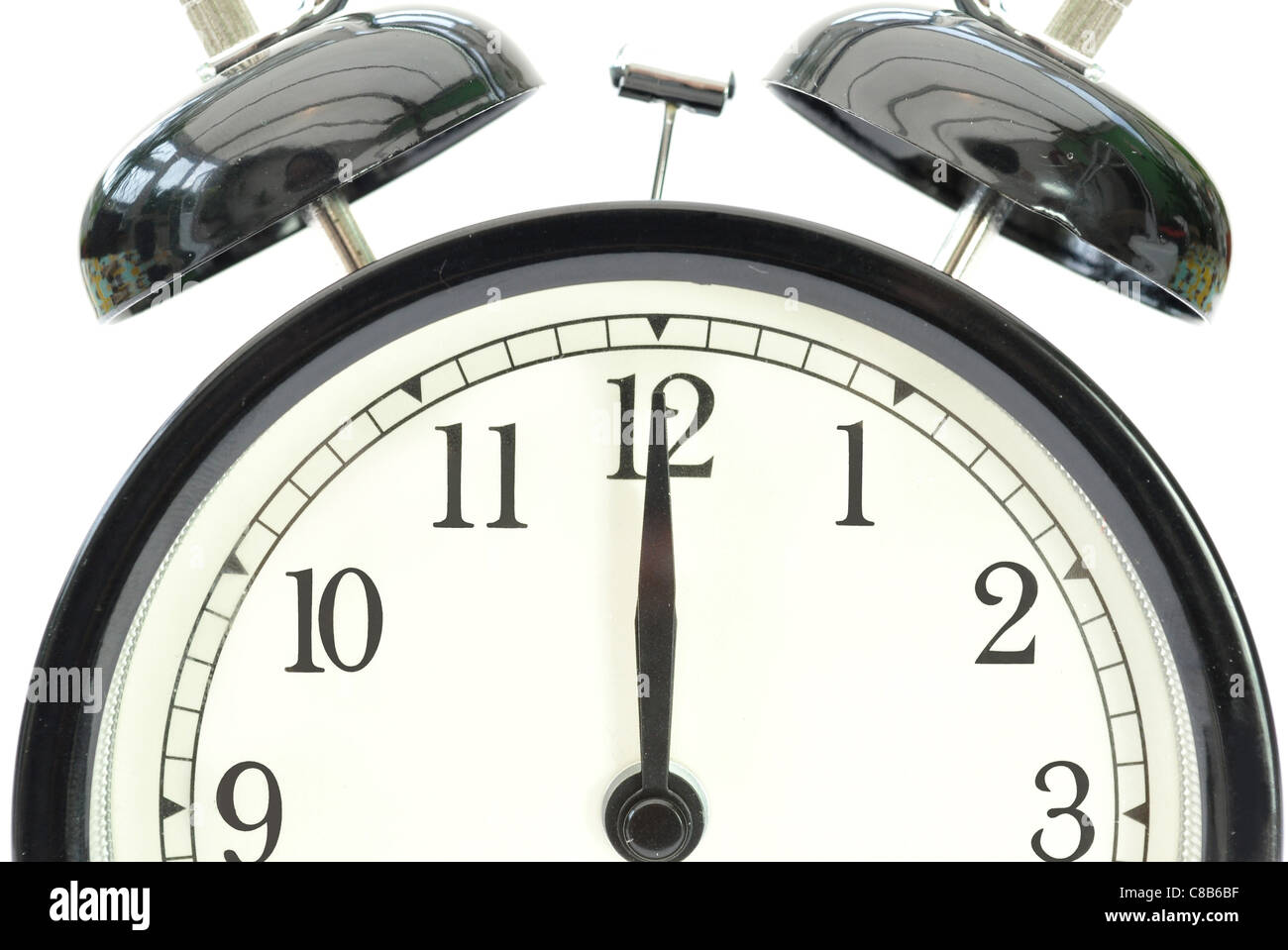 Closeup of an alarm clock face at 12 o'clock Stock Photo - Alamy
