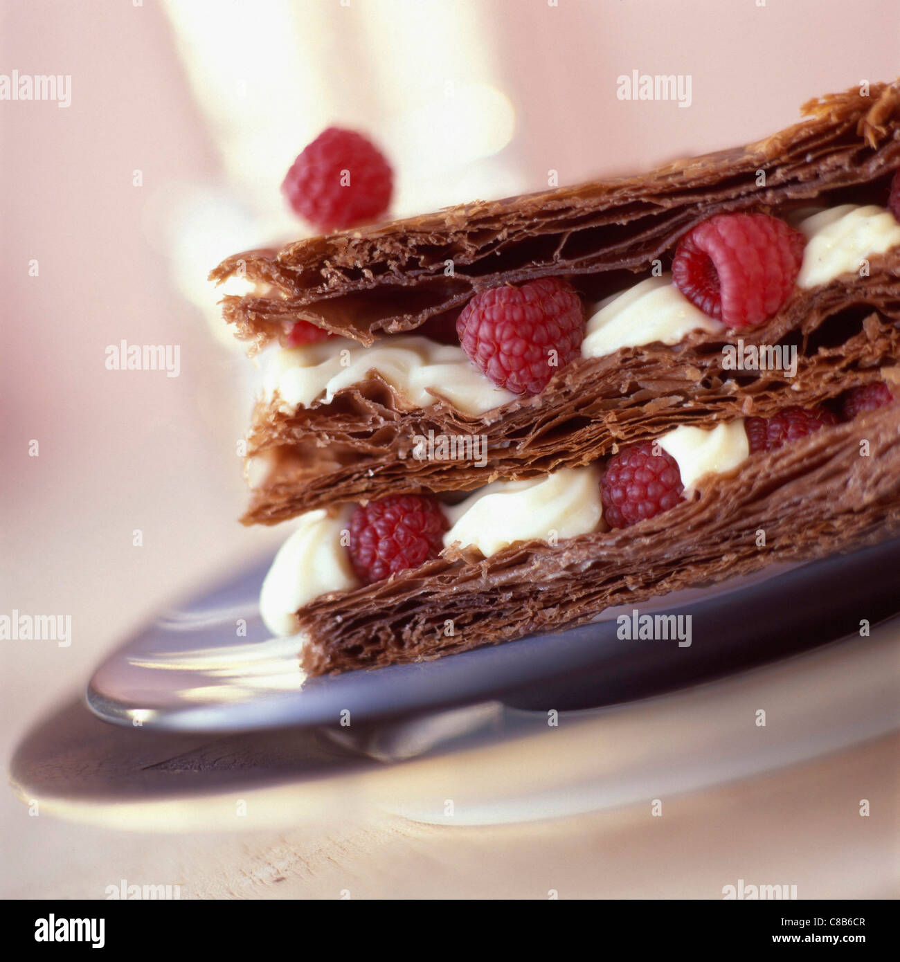 chocolate, cream and raspberry flaky pastry dessert Stock Photo - Alamy