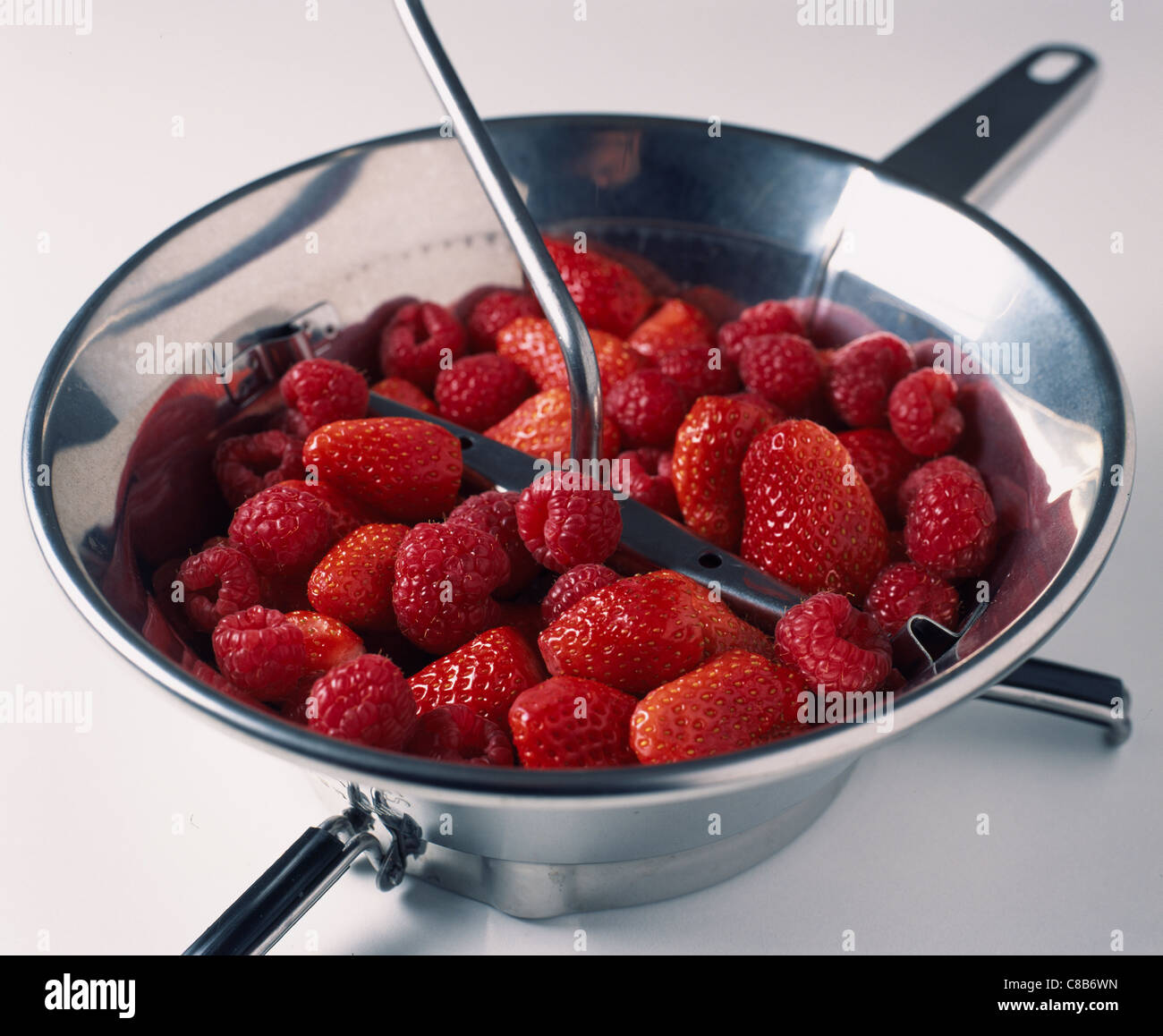 Fresh, whole strawberries in colander Stock Photo - Alamy