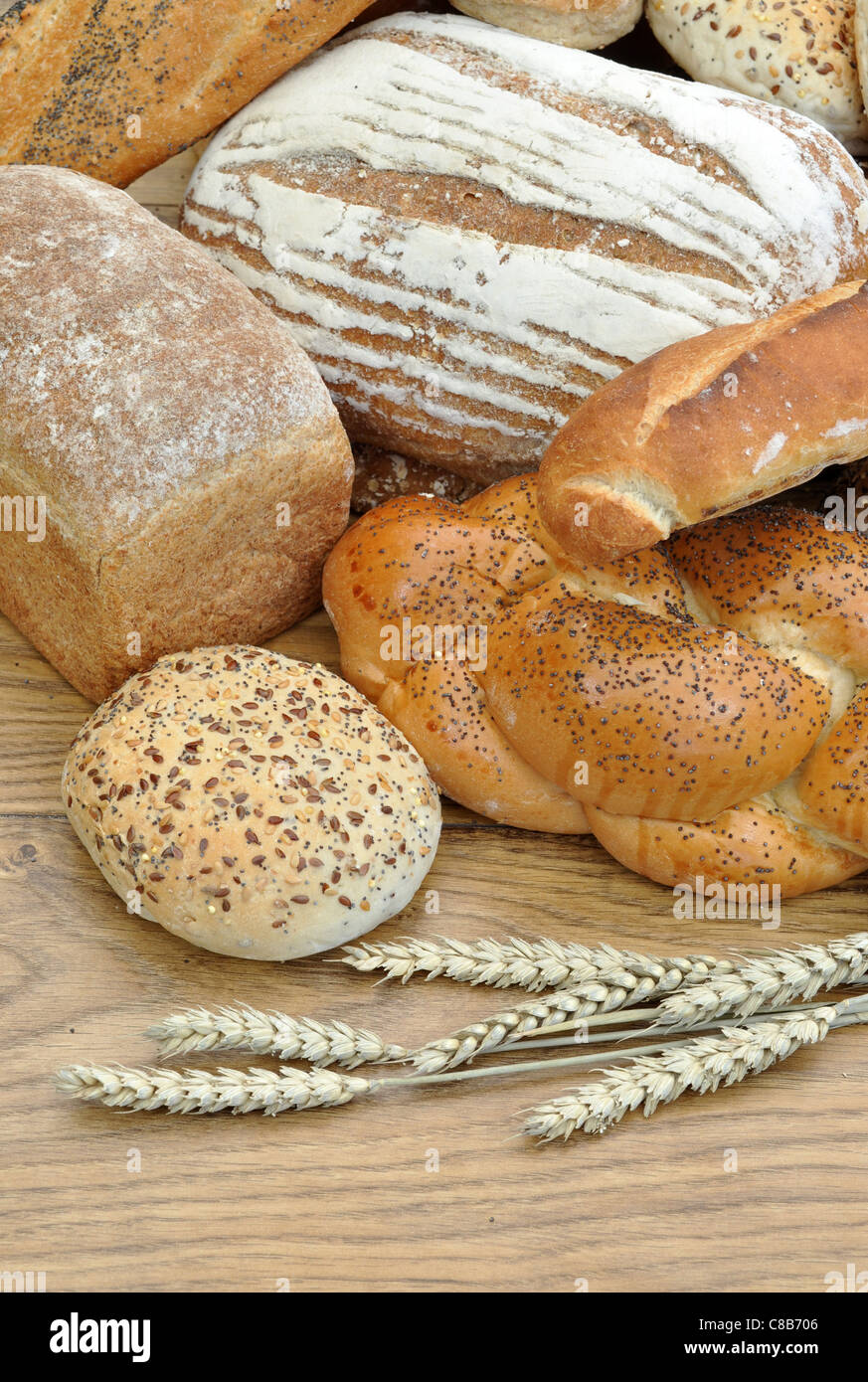 Bakery bread loaves and baguettes with wheat spikes Stock Photo - Alamy