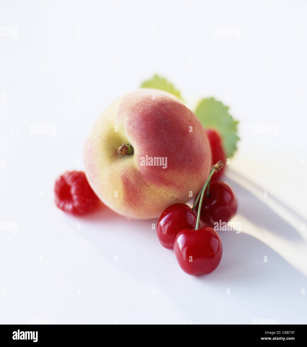 Peach, raspberry, strawberry and cherries Stock Photo - Alamy