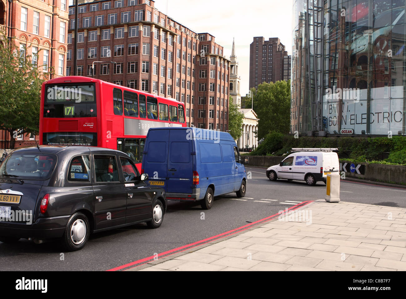 traffic waiting for a van to pass before entering a roundabout in ...