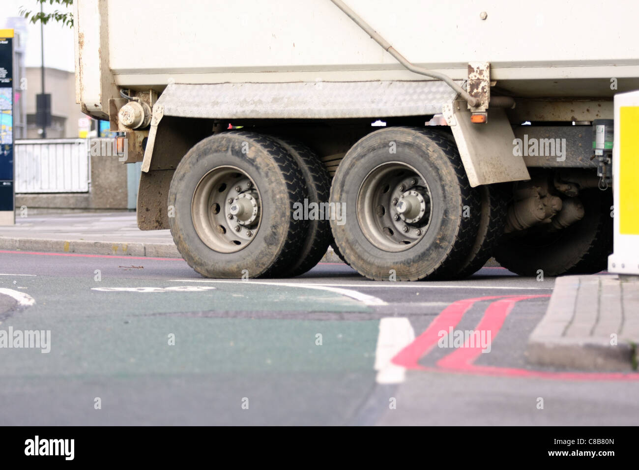 a low level view of the front wheels of a truck as it travels along a ...