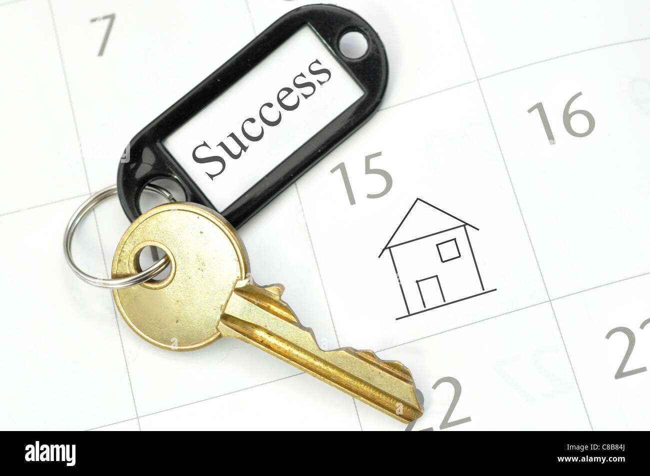 Gold key on top of a calendar entry Stock Photo - Alamy
