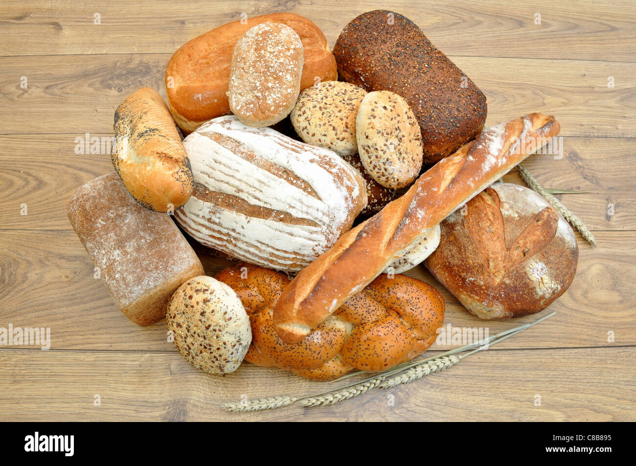 Assortment of bakery products including bread loaves and baguettes ...