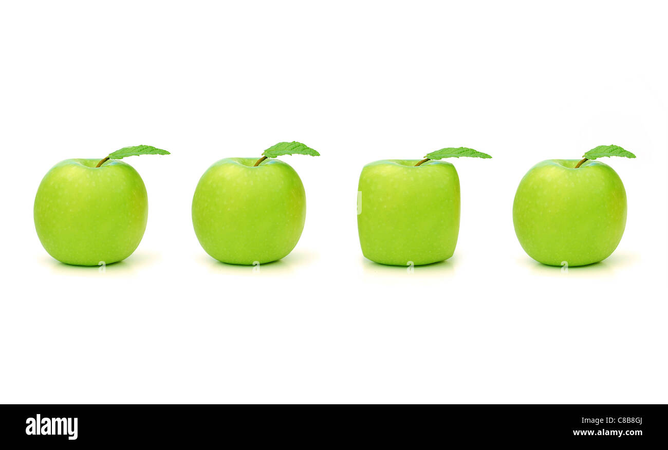 Square shaped fruit amongst a row of apples Stock Photo - Alamy