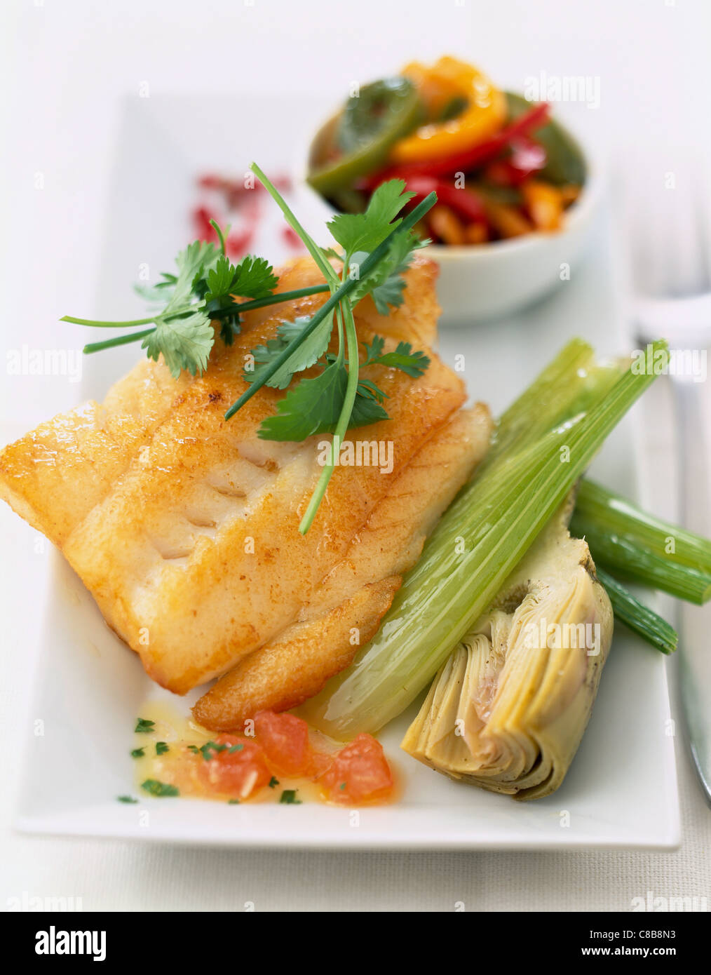 Cod with vegetables Stock Photo - Alamy