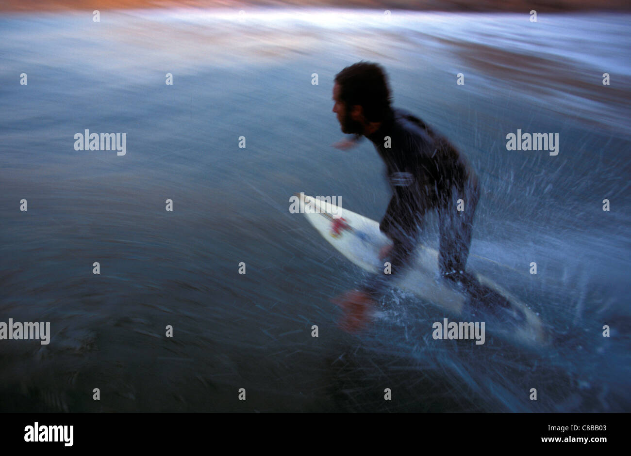Brazilian traveler surfing at Panic Point in northern Peru. Cabo Blanco ...