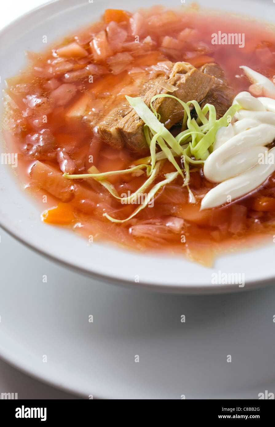 hot red soup with meat and cream Stock Photo - Alamy