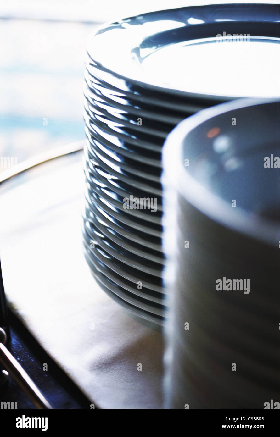 plates stacked on tray Stock Photo - Alamy