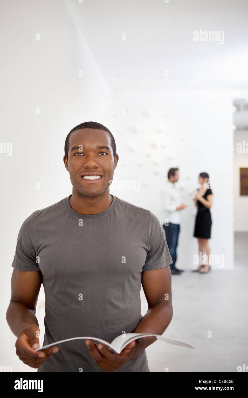 Front view of young man in casual looking up Stock Photo - Alamy
