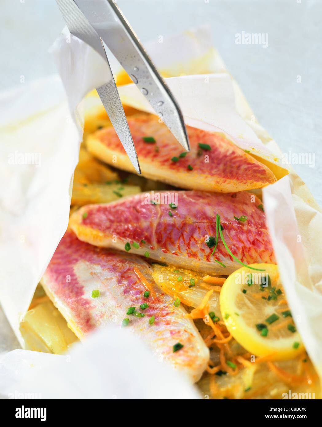 surmullet fillets en papillote with fennel Stock Photo - Alamy