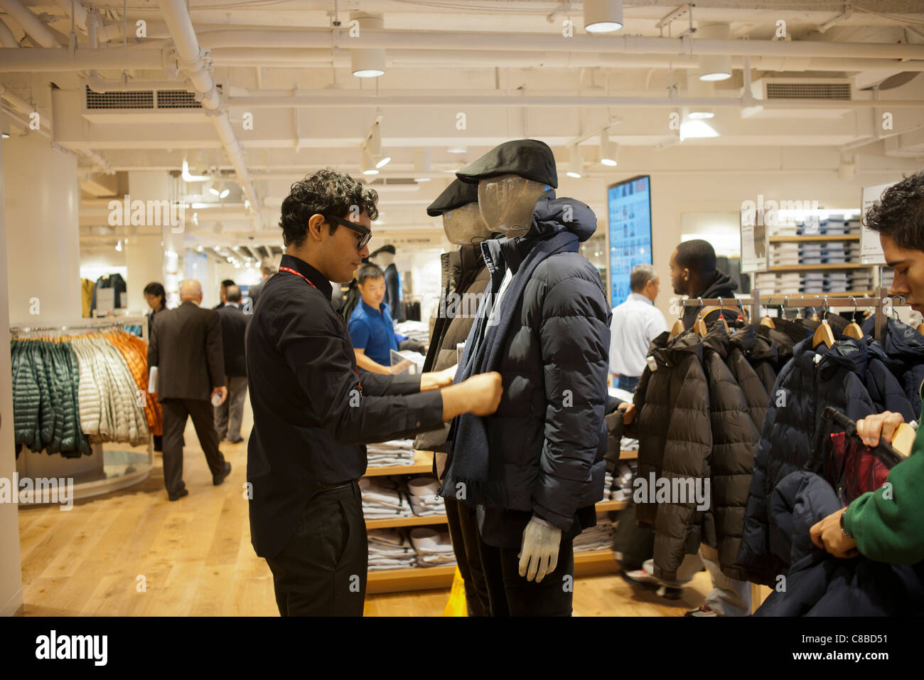 Customers shop at the grand opening of the Uniqlo Flagship store on ...