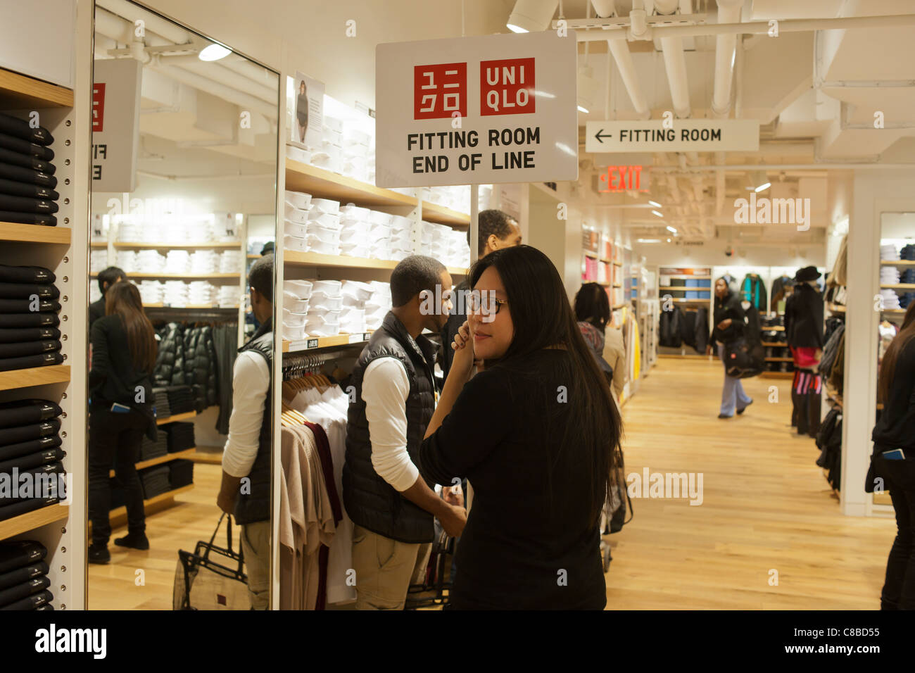 Customers shop at the grand opening of the Uniqlo Flagship store on ...