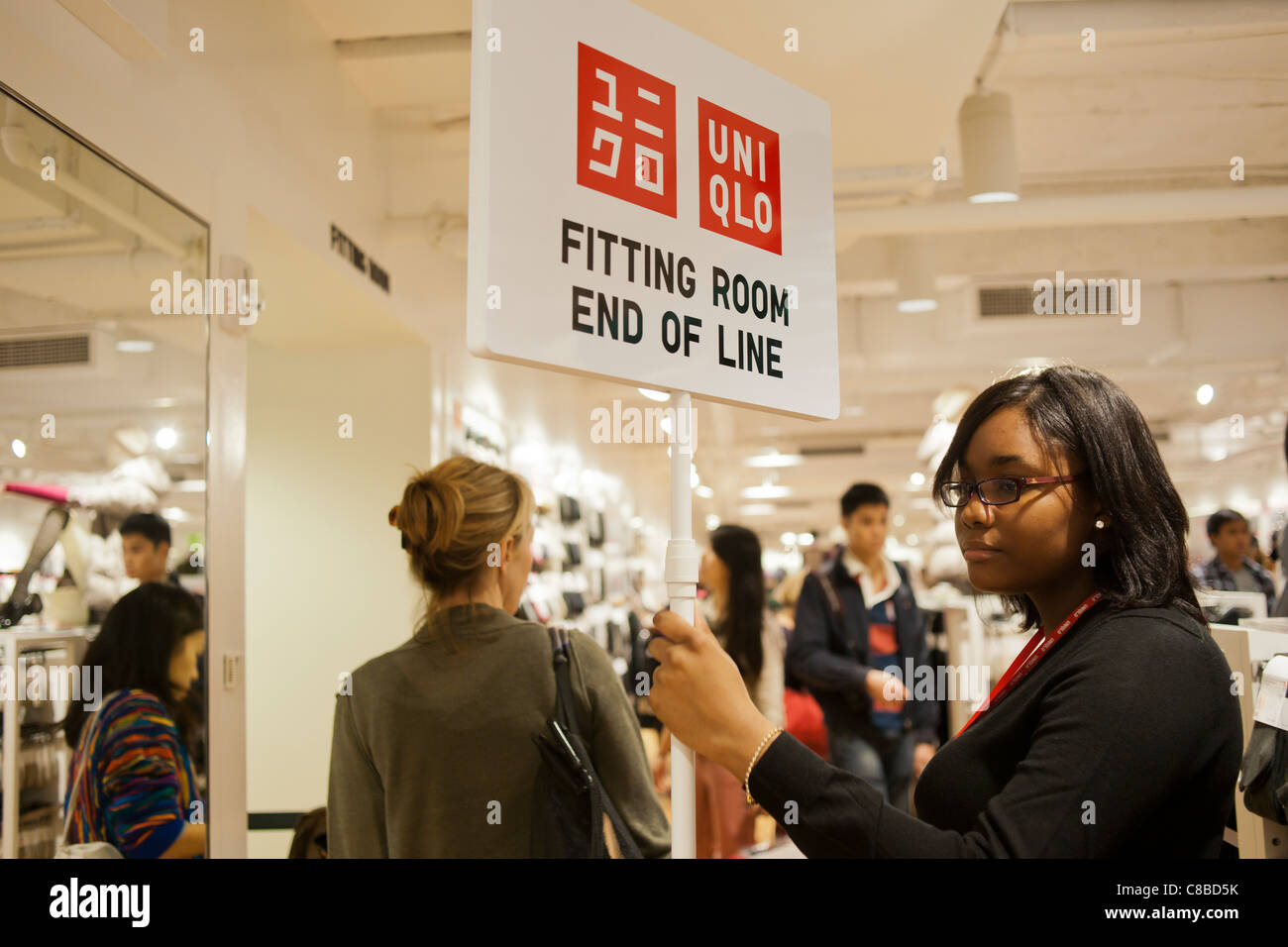 Customers shop at the grand opening of the Uniqlo Flagship store on ...