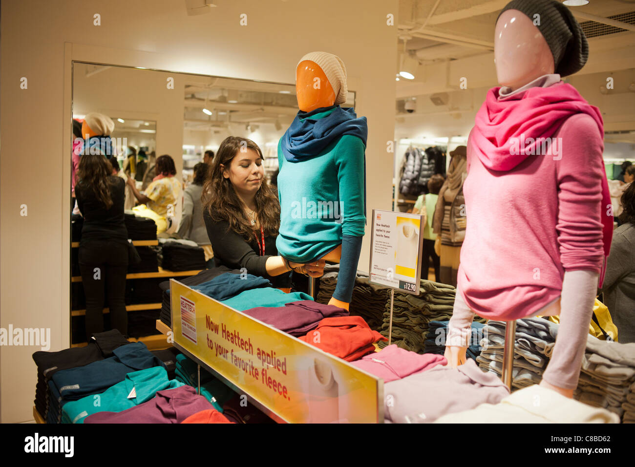 Customers shop at the grand opening of the Uniqlo Flagship store on ...