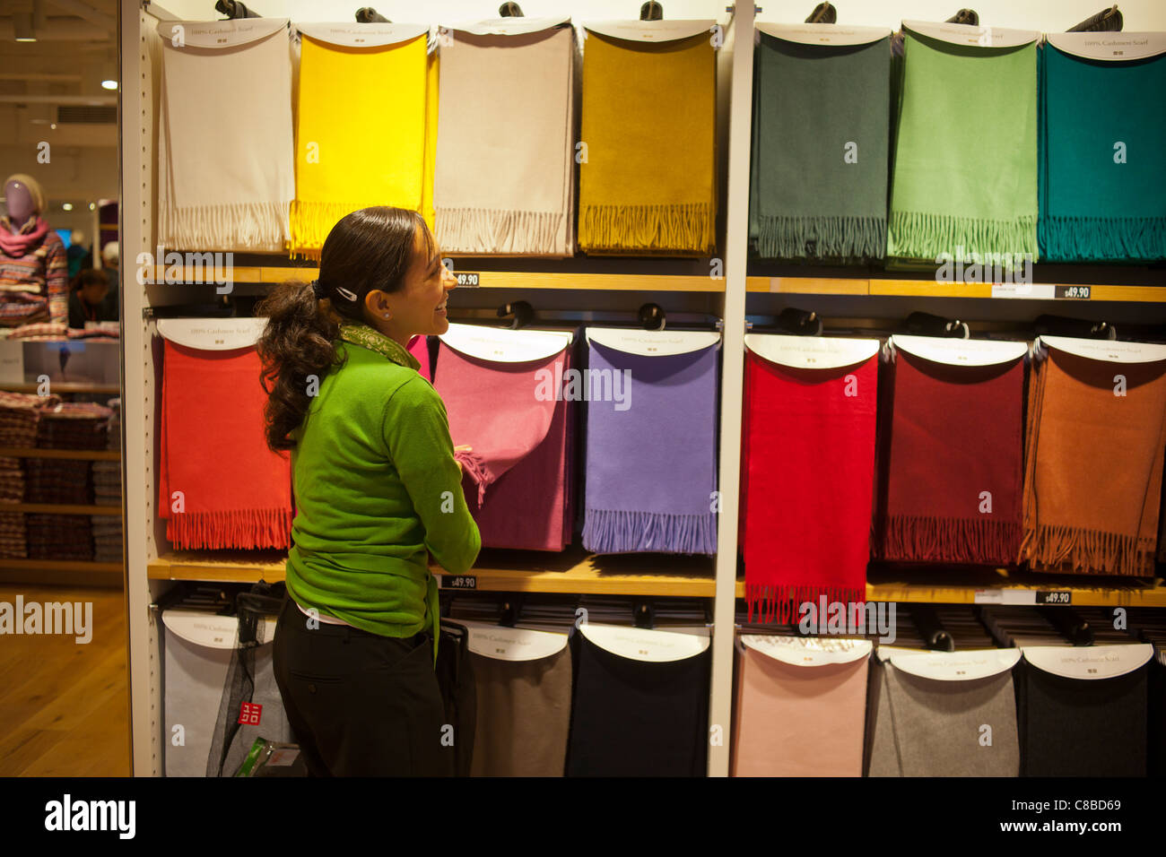Customers shop at the grand opening of the Uniqlo Flagship store on ...