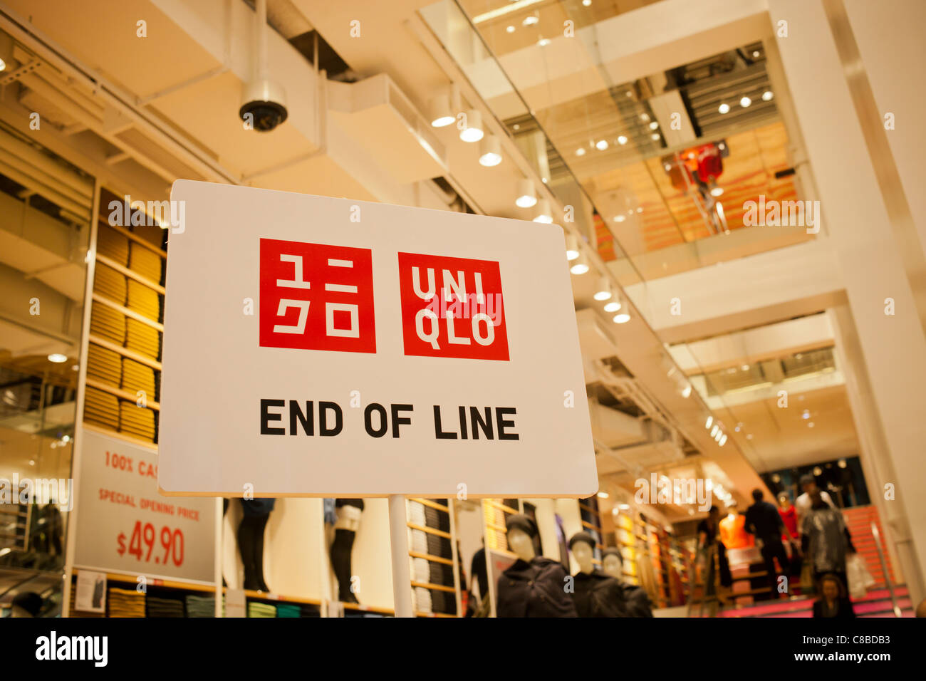 Customers shop at the grand opening of the Uniqlo Flagship store on ...