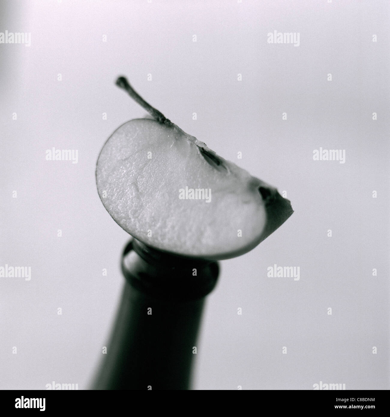 apple segment on bottle Stock Photo - Alamy