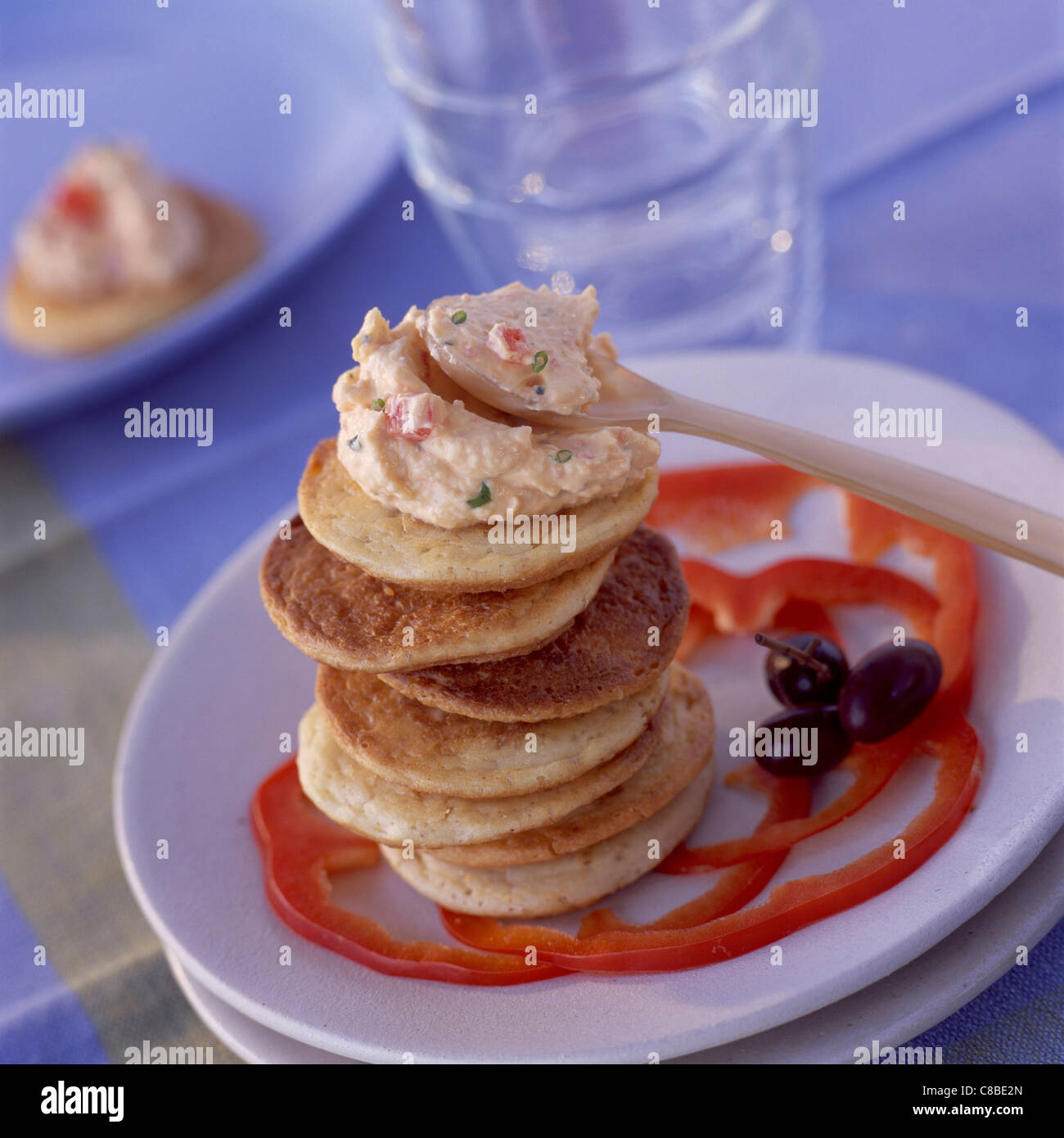 mini blinis with cream Stock Photo - Alamy