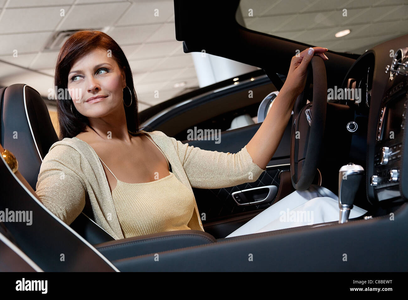 Woman having a test drive Stock Photo - Alamy