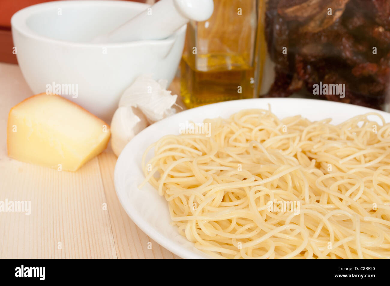 Italian Cuisine - spaghetti, dried tomatoes, pecorino cheese, garlic ...